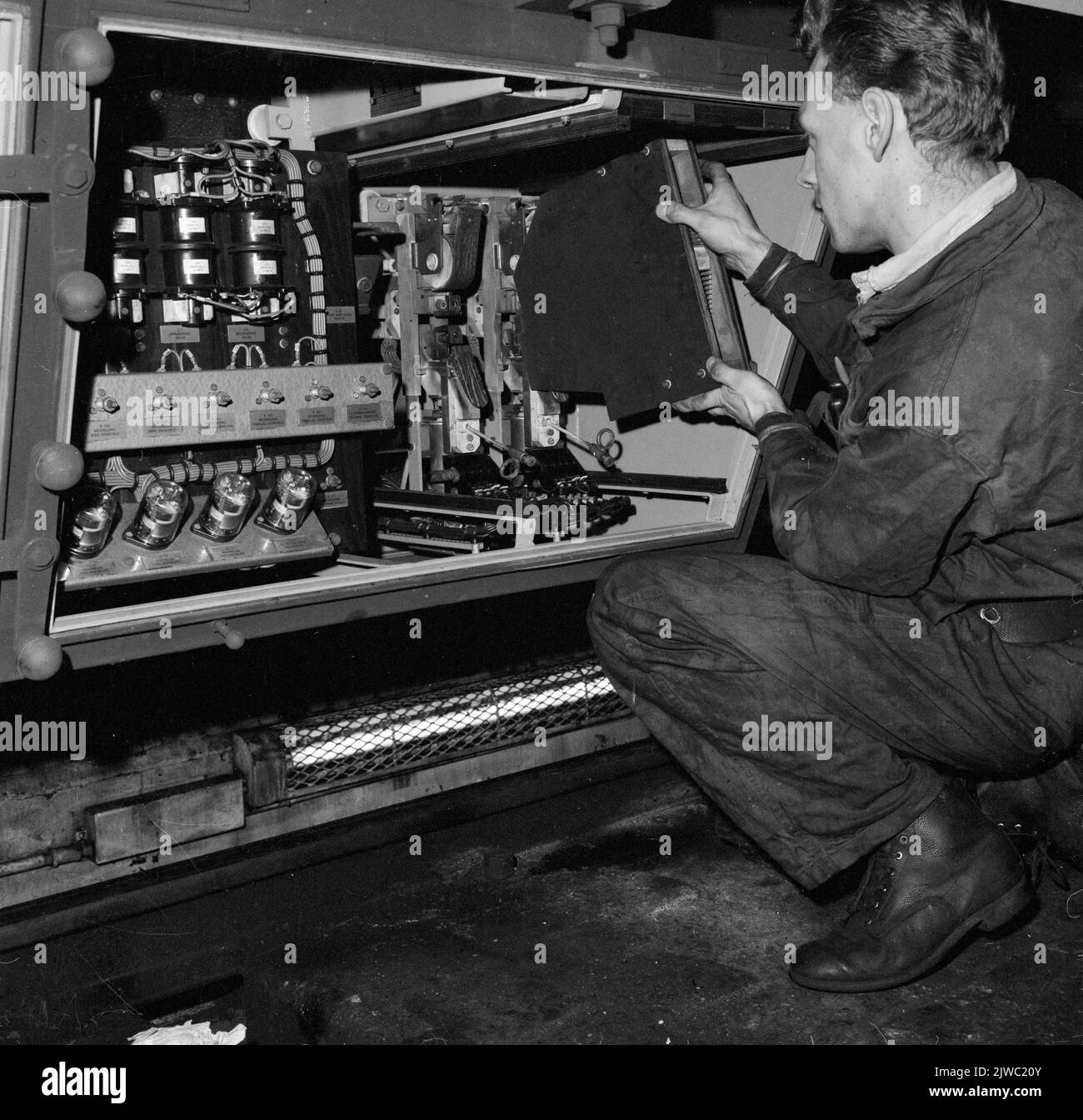 Image of a maintenance engineer during work on the electrical ...