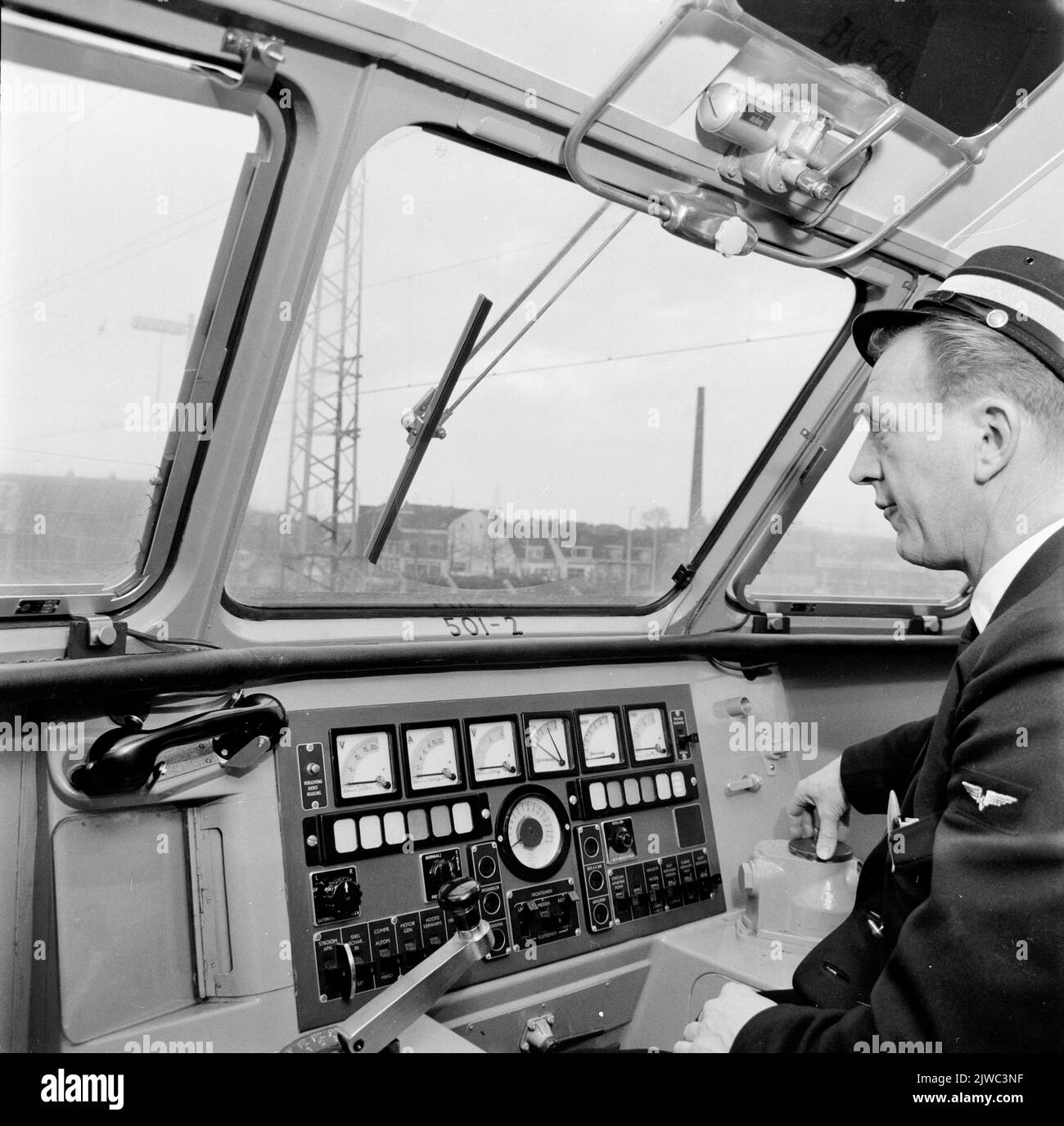 Image of a driver in the steering position of the Electric train set no ...