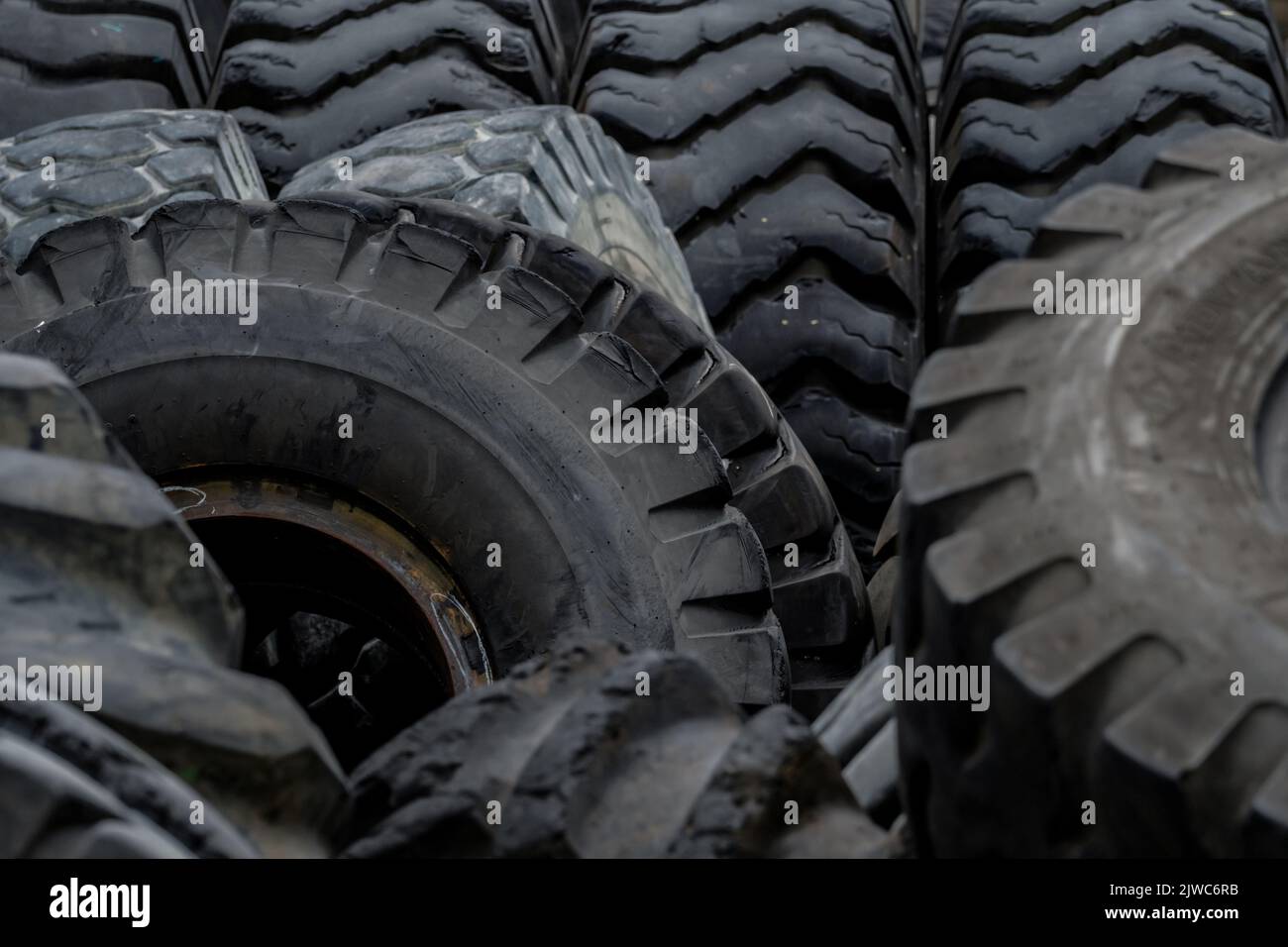 Closeup used truck tires. Old tyres waste for recycle or for landfill ...