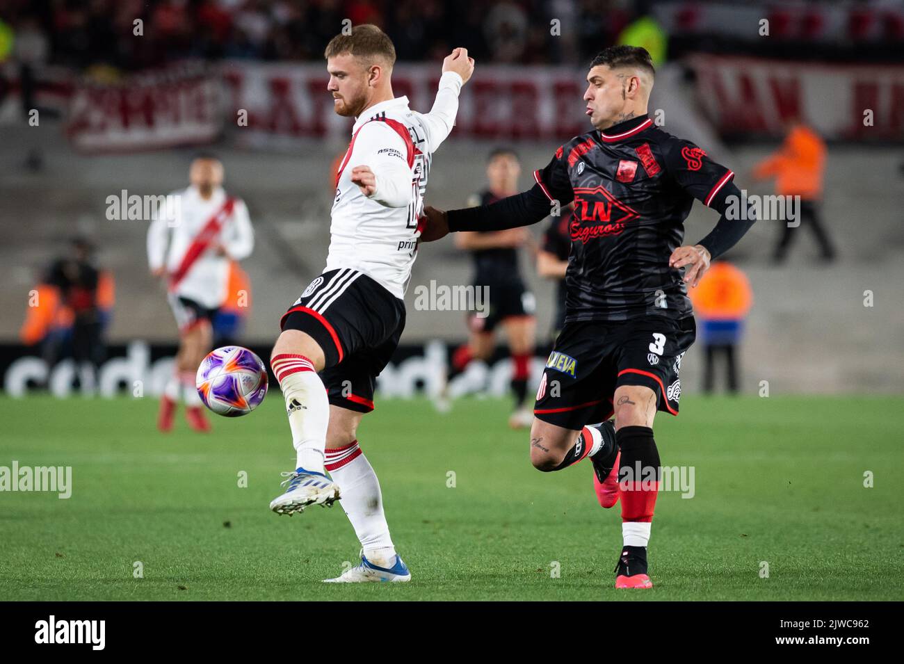 Lucas Beltran of River Plate and Gonzalo Paz of Barracas seen in action ...