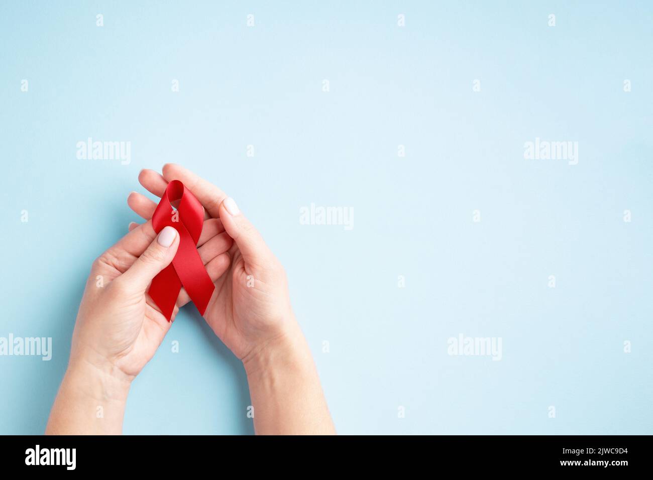Aids day hand red hi-res stock photography and images - Alamy
