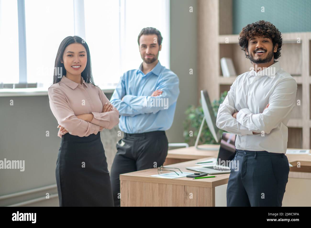 Young business people looking excited and happy Stock Photo - Alamy