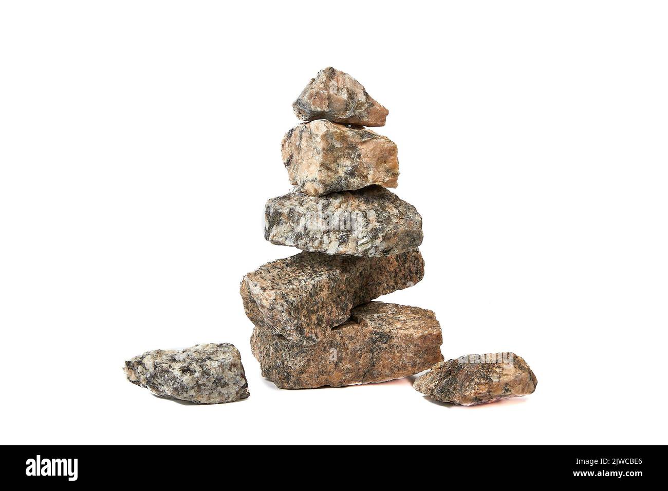 Textured stones stacked in a pyramid on a white background Stock Photo ...