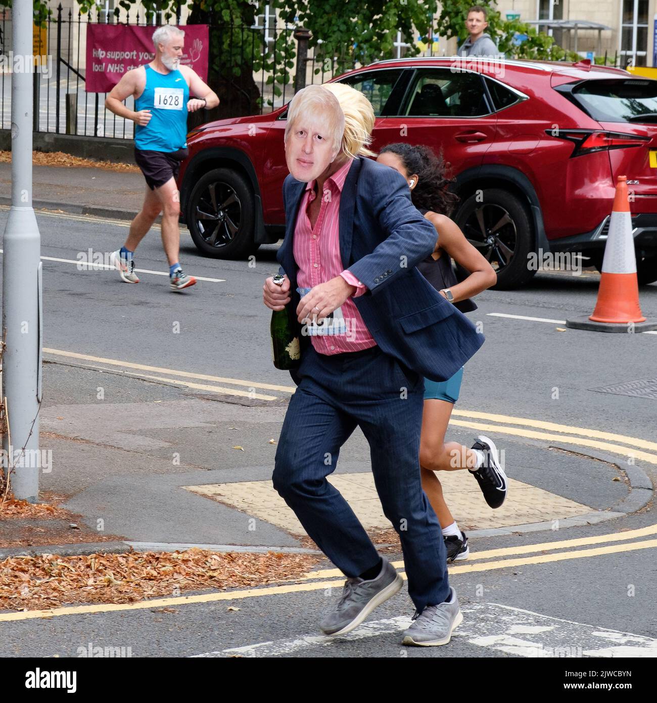 A runner dressed as Boris Johnson running in a half marathon Stock ...