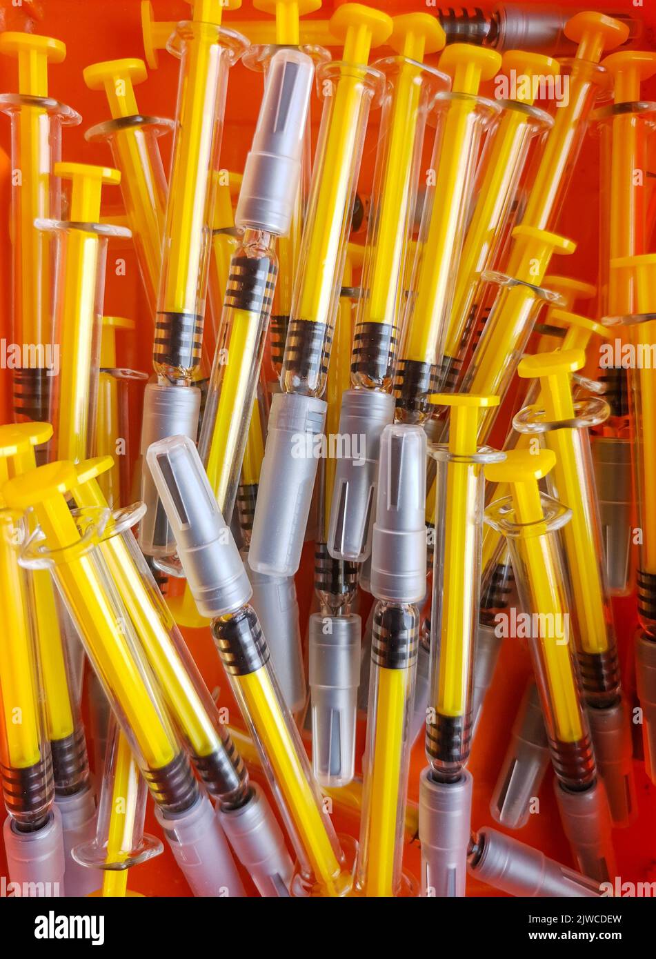 A close-up with many used syringes, hazardous, danger Stock Photo - Alamy