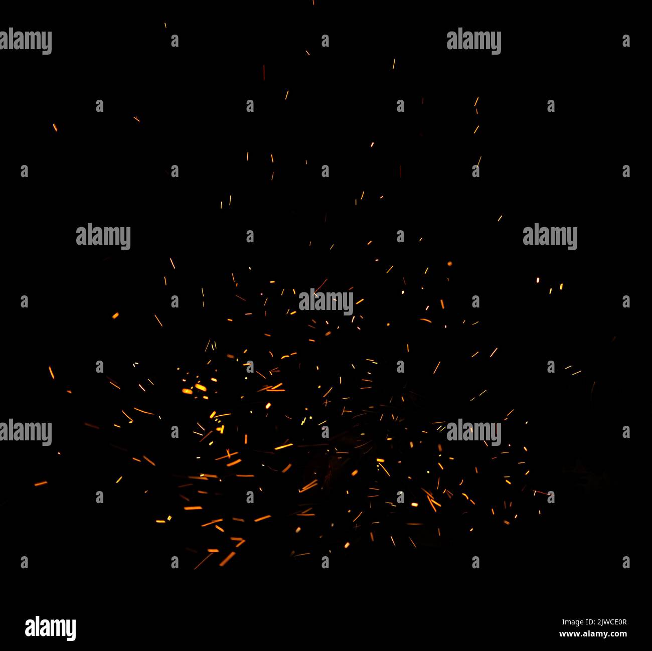 Campfire flame sparks isolated on black background. Fire flames heat ...