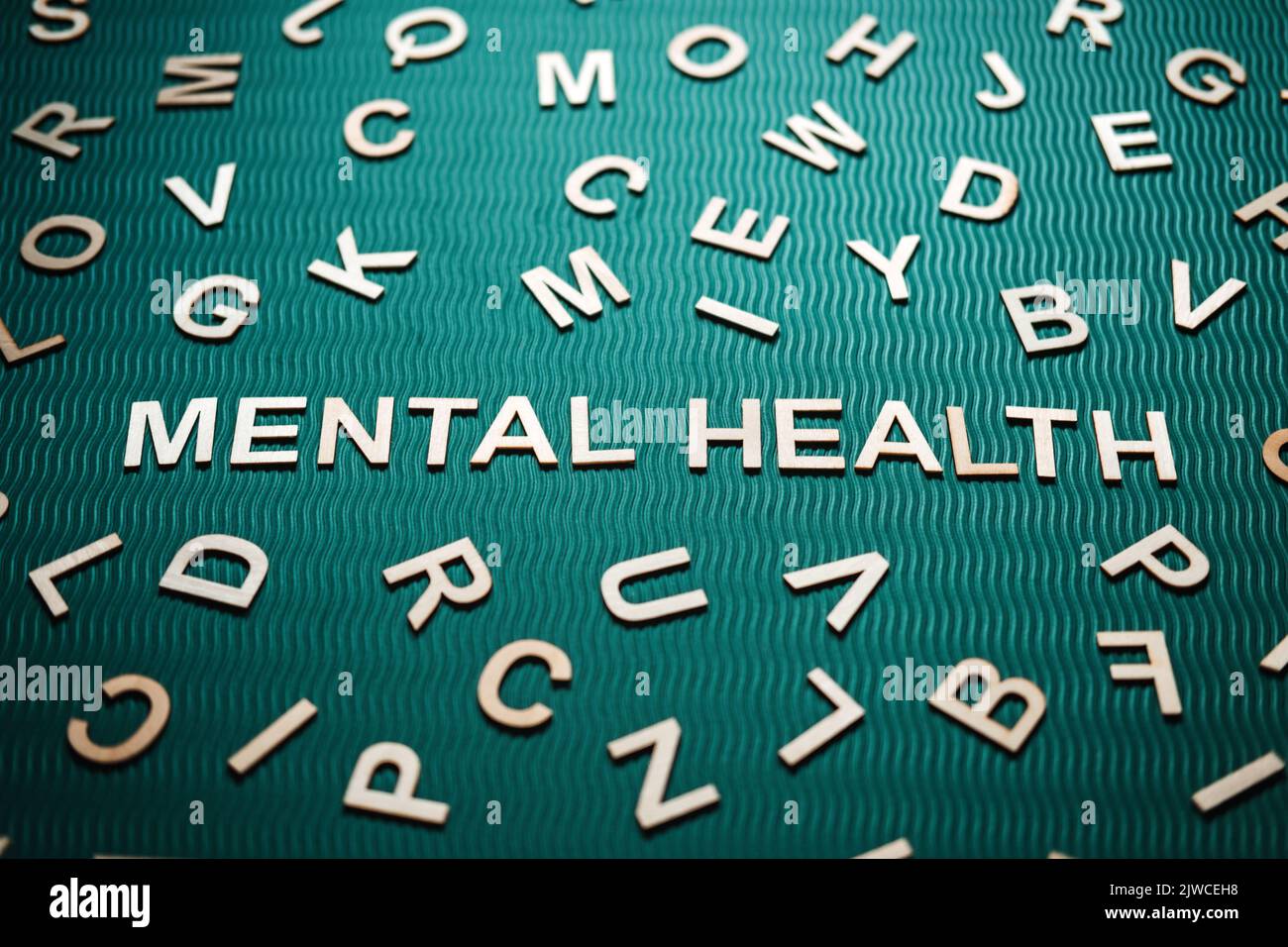 Mental health word from wooden letters. Mental health text on green ...