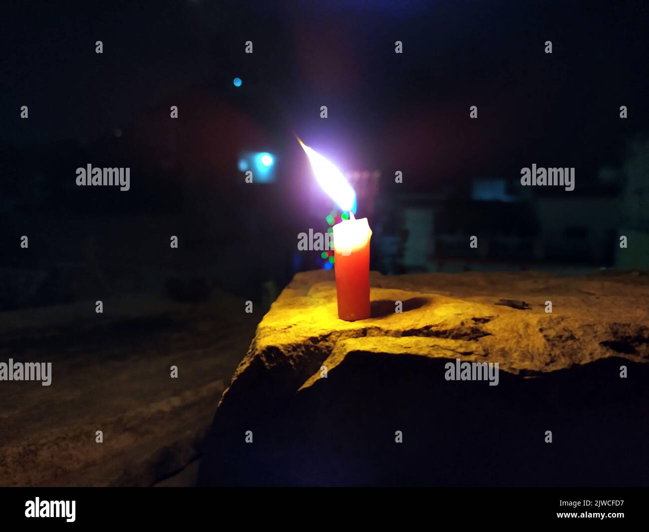 a candal flame is lightning in very dark night Stock Photo - Alamy