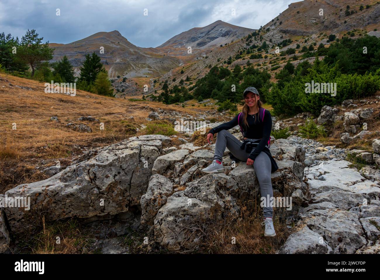 young woman relaxing in the mountains , adventure holidays lifestyle ...