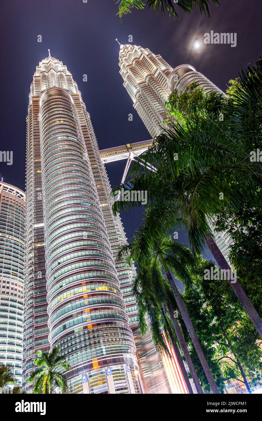 Portrait, close-up image of the Petronas Twin Towers with the moon ...