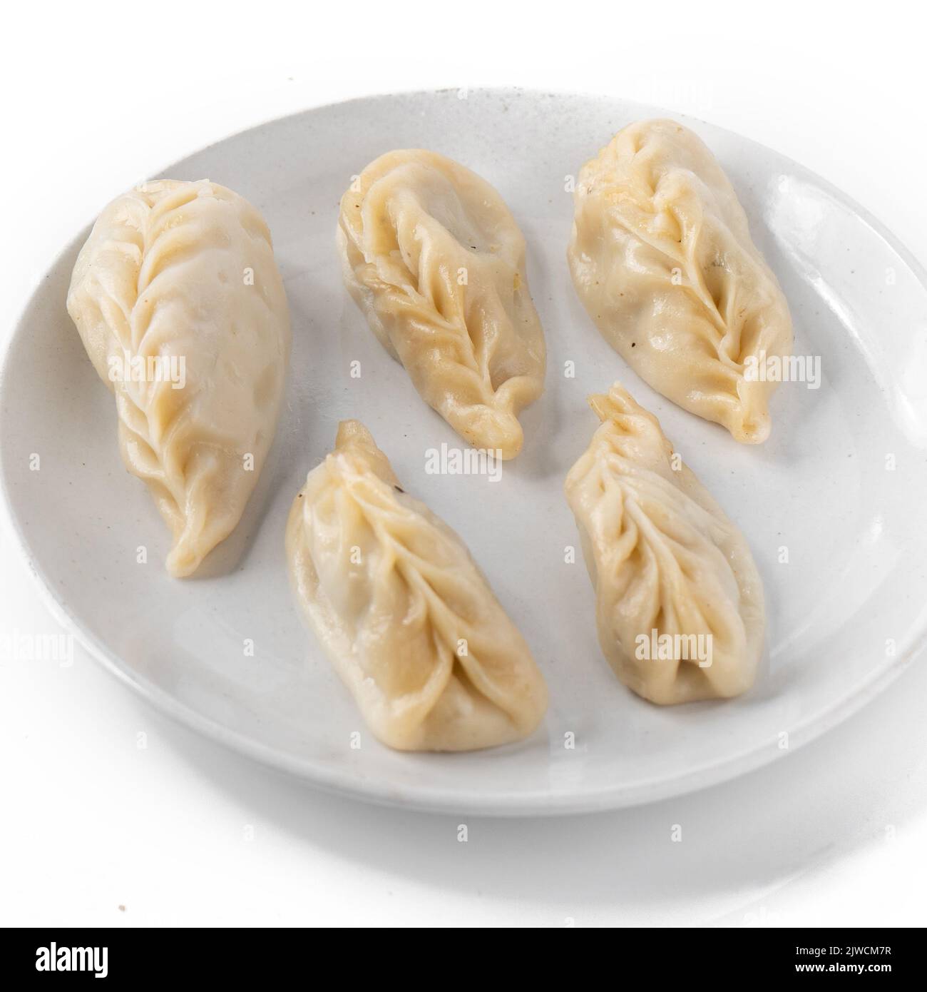 Traditional Dumpling Momos Served on white plate Stock Photo - Alamy