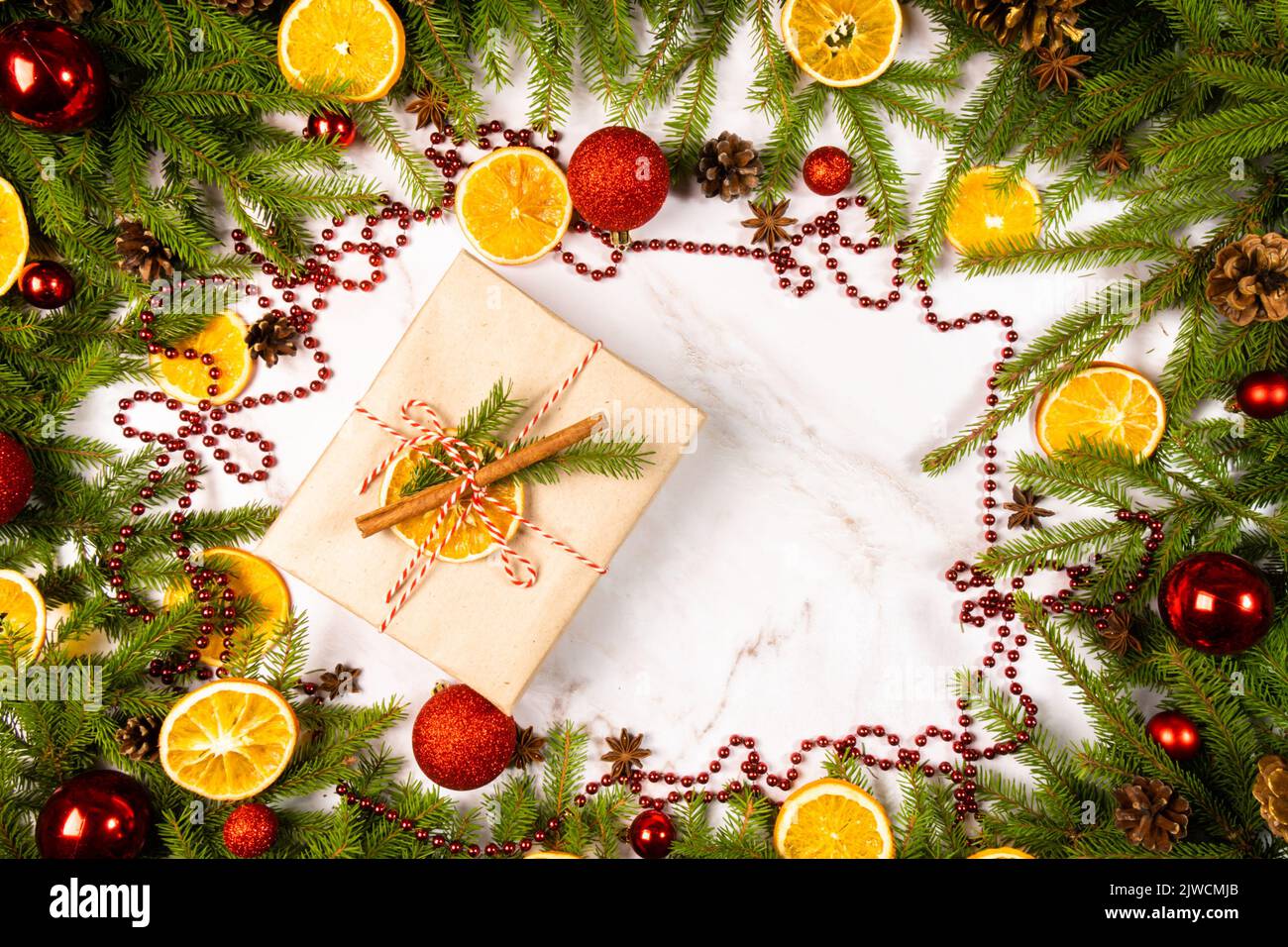 Branches of a Christmas tree with a zero waste gift box, cones ...