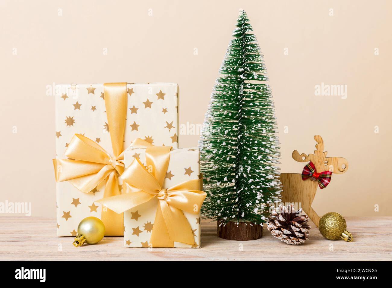 Christmas composition. craft Gift box, small tree, branches and craft ...