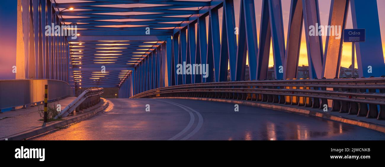 road crossing the truss bridge during an evening thunderstorm Stock ...