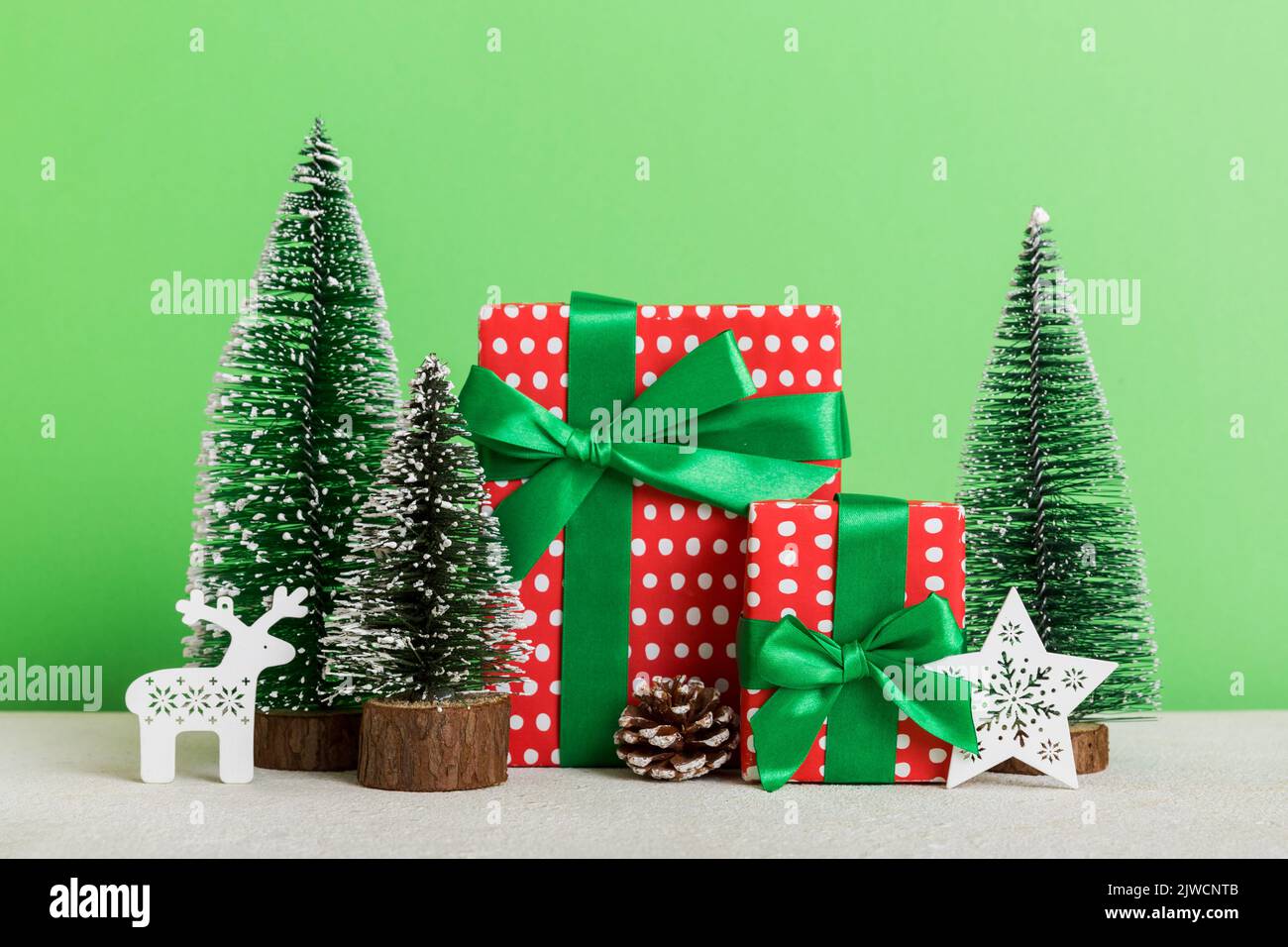 Christmas composition. craft Gift box, small tree, branches and craft ...