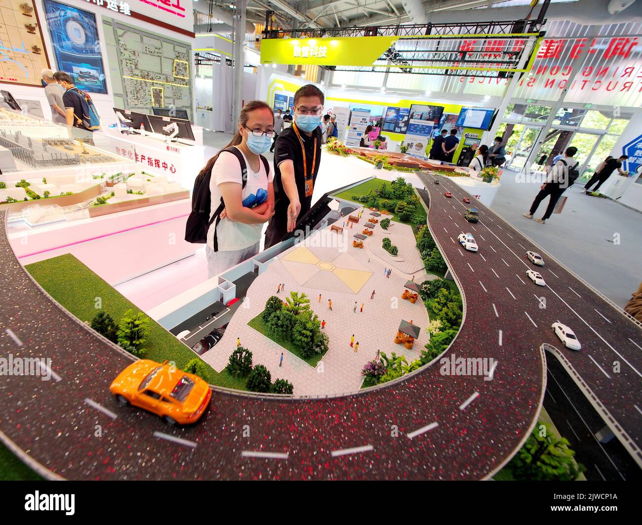 BEIJING, CHINA - SEPTEMBER 5, 2022 - Visitors look at the parking model ...