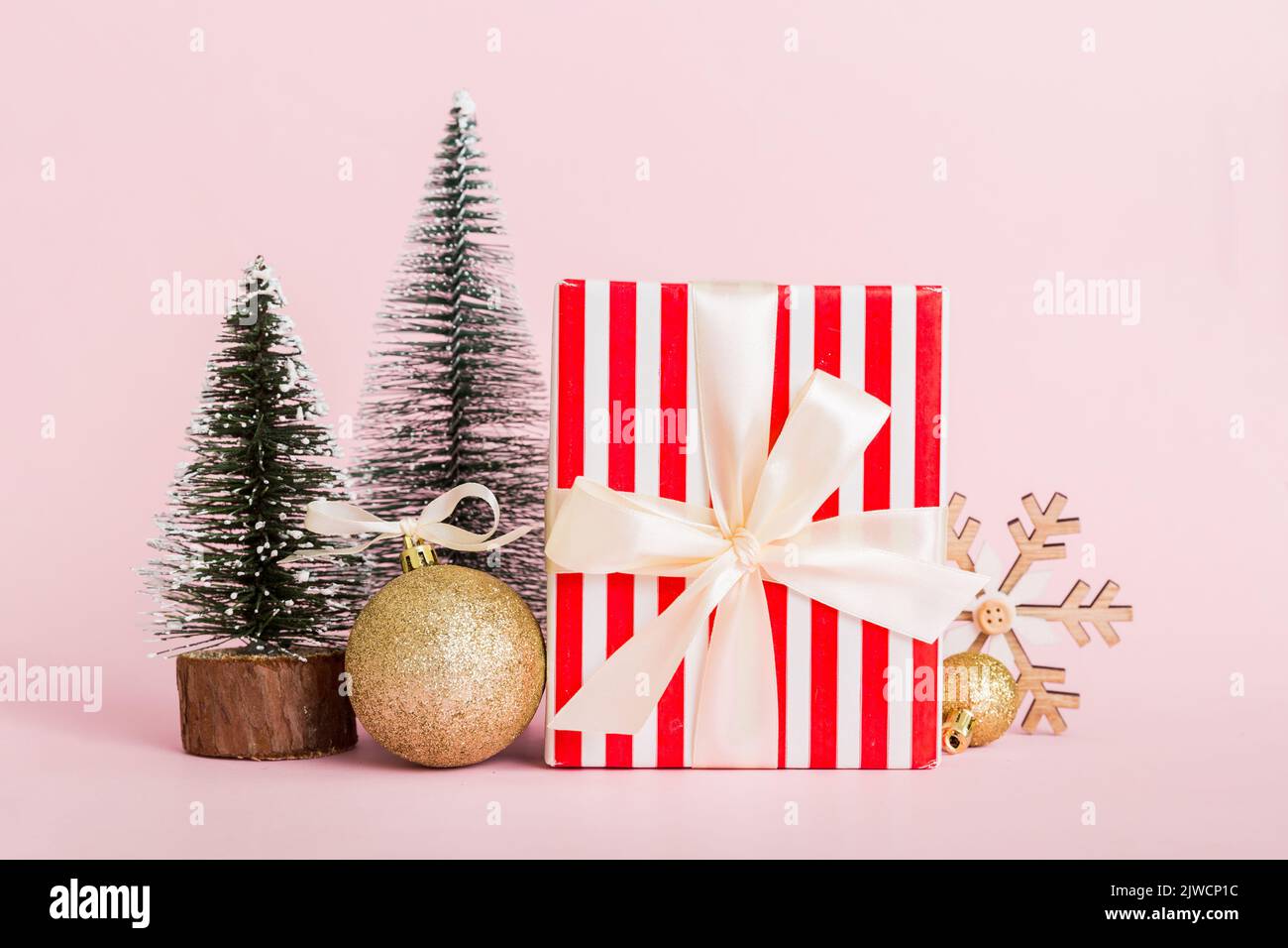 Christmas composition. craft Gift box, small tree, branches and craft ...