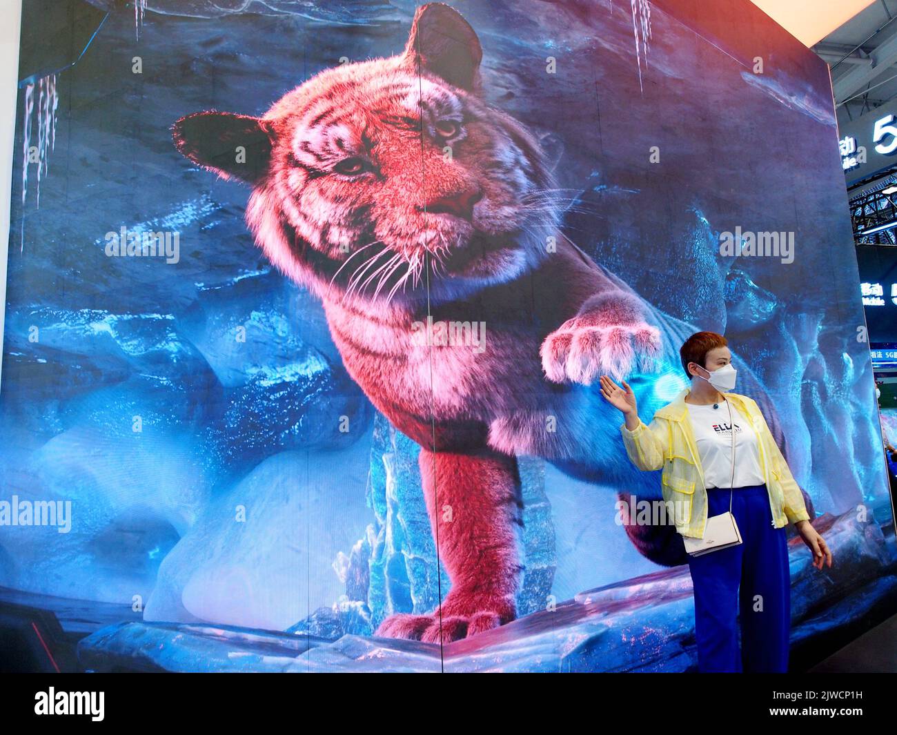 BEIJING, CHINA - SEPTEMBER 5, 2022 - Visitors pose In front of a MINI ...