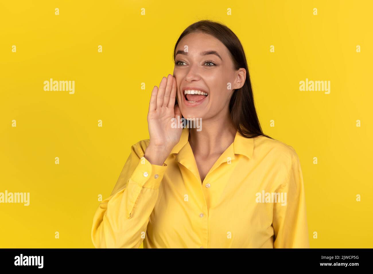 Joyful Lady Shouting Holding Hand Near Mouth Over Yellow Background ...