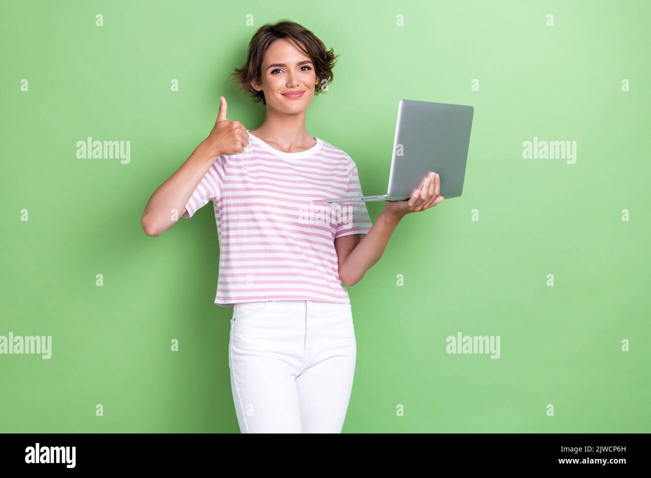 Photo of young attractive pretty positive girl thumb up showing good ...