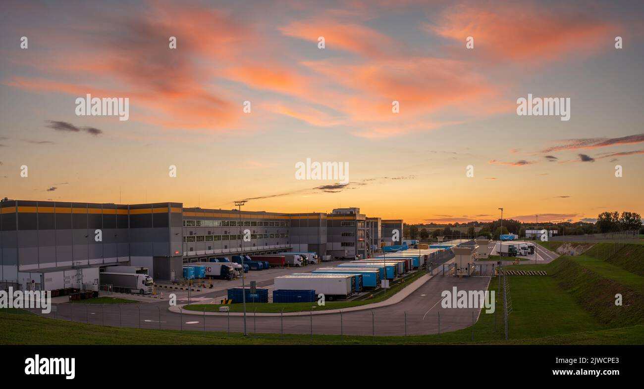 Amazon logistics centre during sunset Stock Photo - Alamy