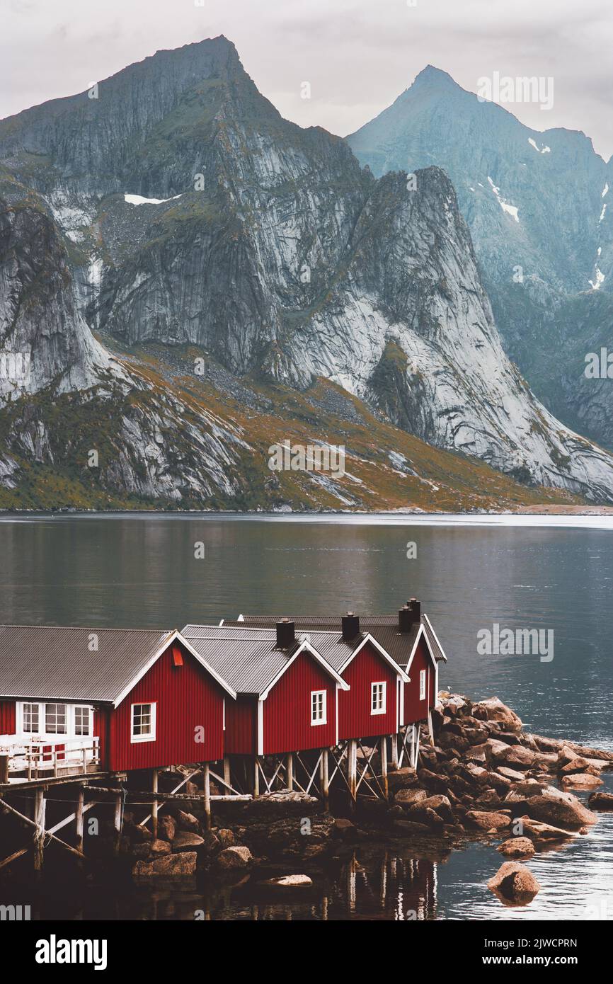 Red wooden houses rorbu in Norway mountains view Lofoten islands ...