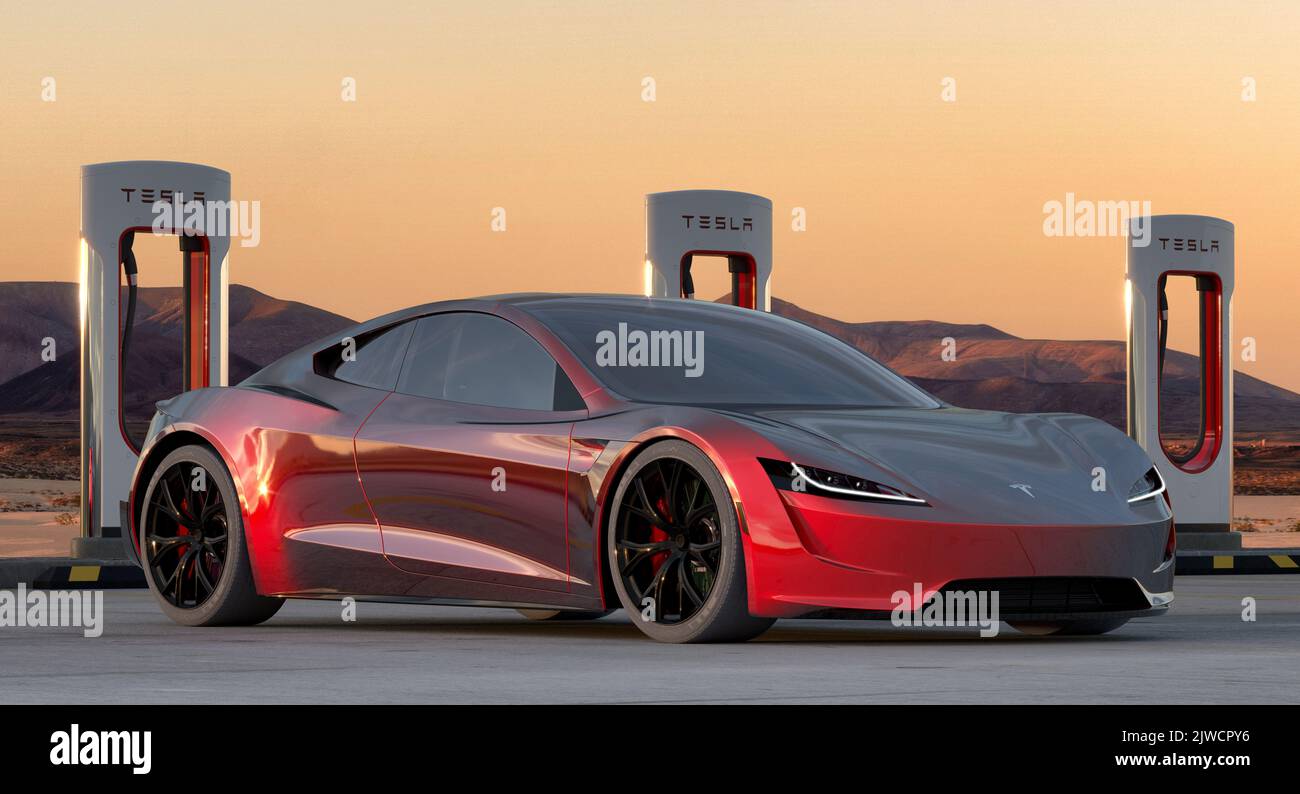 Tesla Roadster at fast charging station Stock Photo - Alamy