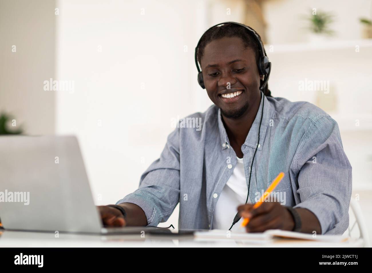 Online Education. Smiling Black Man In Headset Study With Laptop At ...
