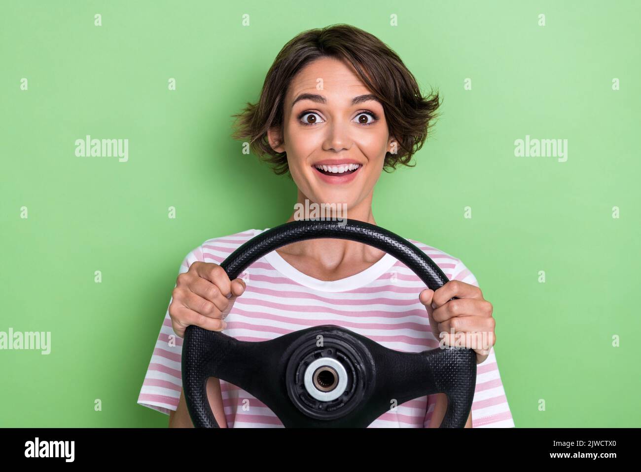 Photo of positive joyful pretty lady drive own car vehicle first lesson ...