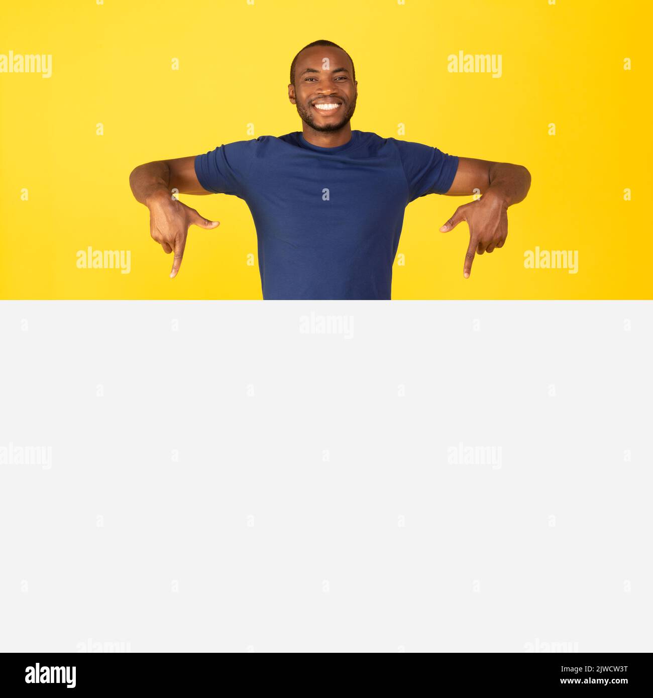 Black Male Pointing Fingers At Blank Paper Poster, Yellow Background ...
