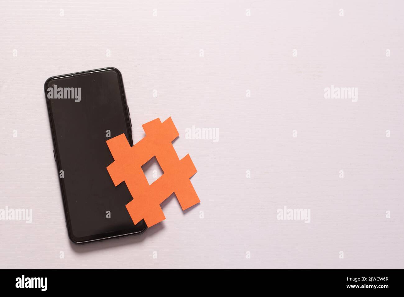 phone and hash tag symbol on a desk Stock Photo - Alamy