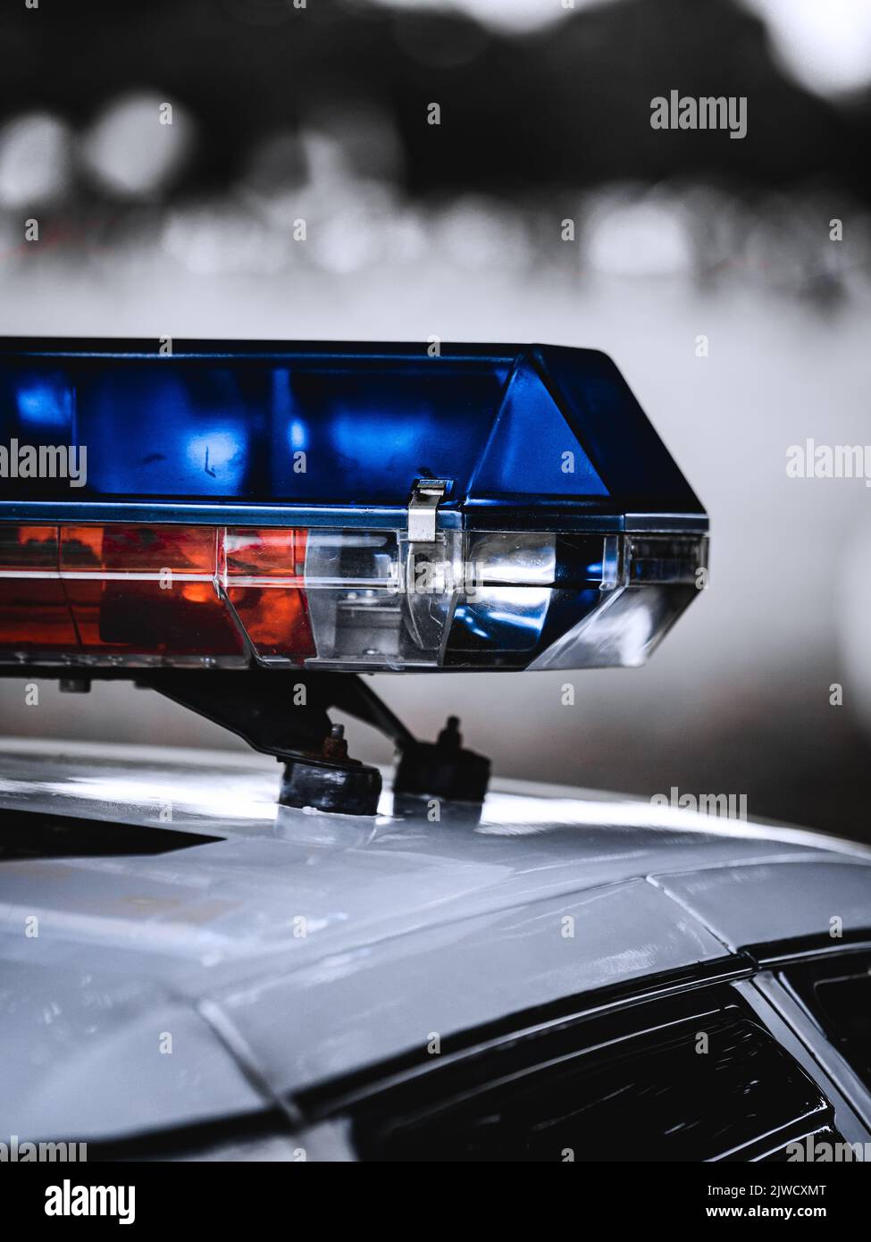 A vertical closeup of a police car emergency light siren Stock Photo ...