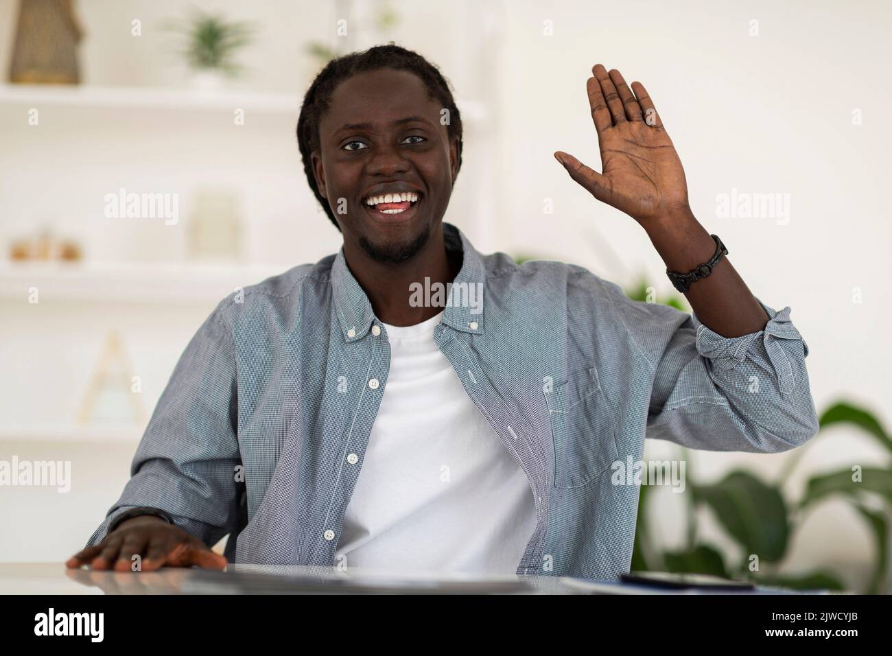 Closeup positive african man waving hi-res stock photography and images ...