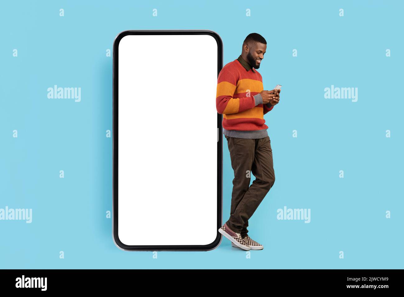 Mobile Offer. Smiling Blank Man With Smartphone Standing Near Big Blank ...