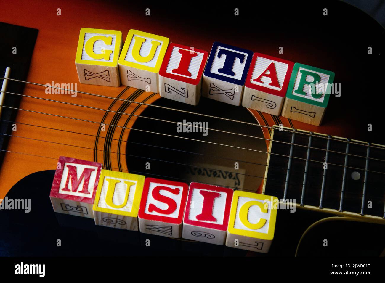 Word or phrase Guitar Music made with the letter cubes, standing on a ...