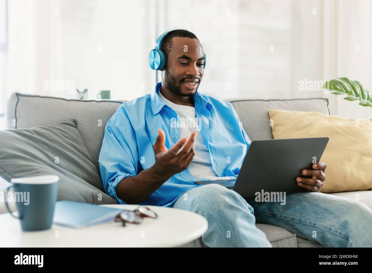 Modern distance online communication. Excited black man chatting online ...