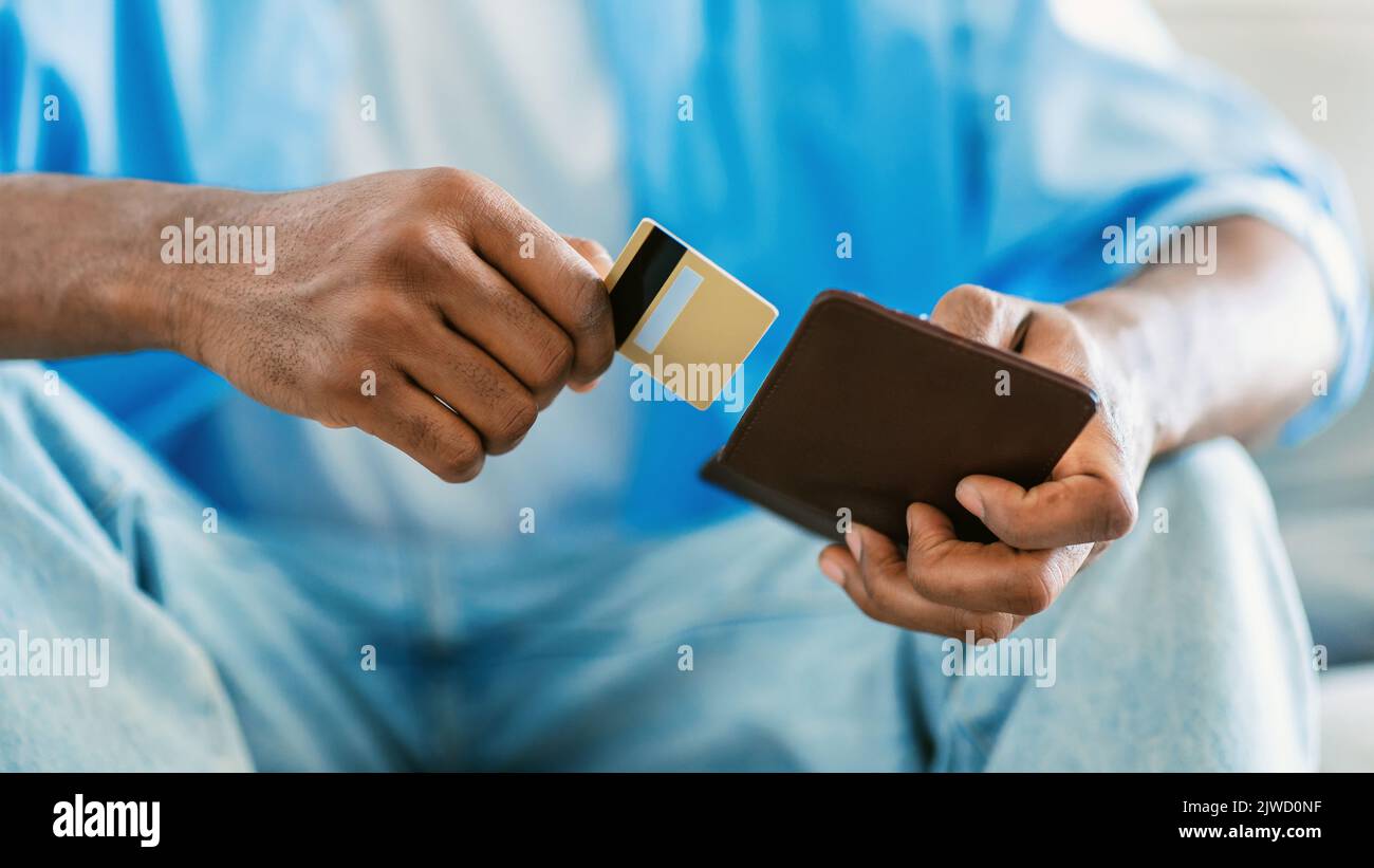 Finance and electronic money. Unrecognizable african ameican man taking ...