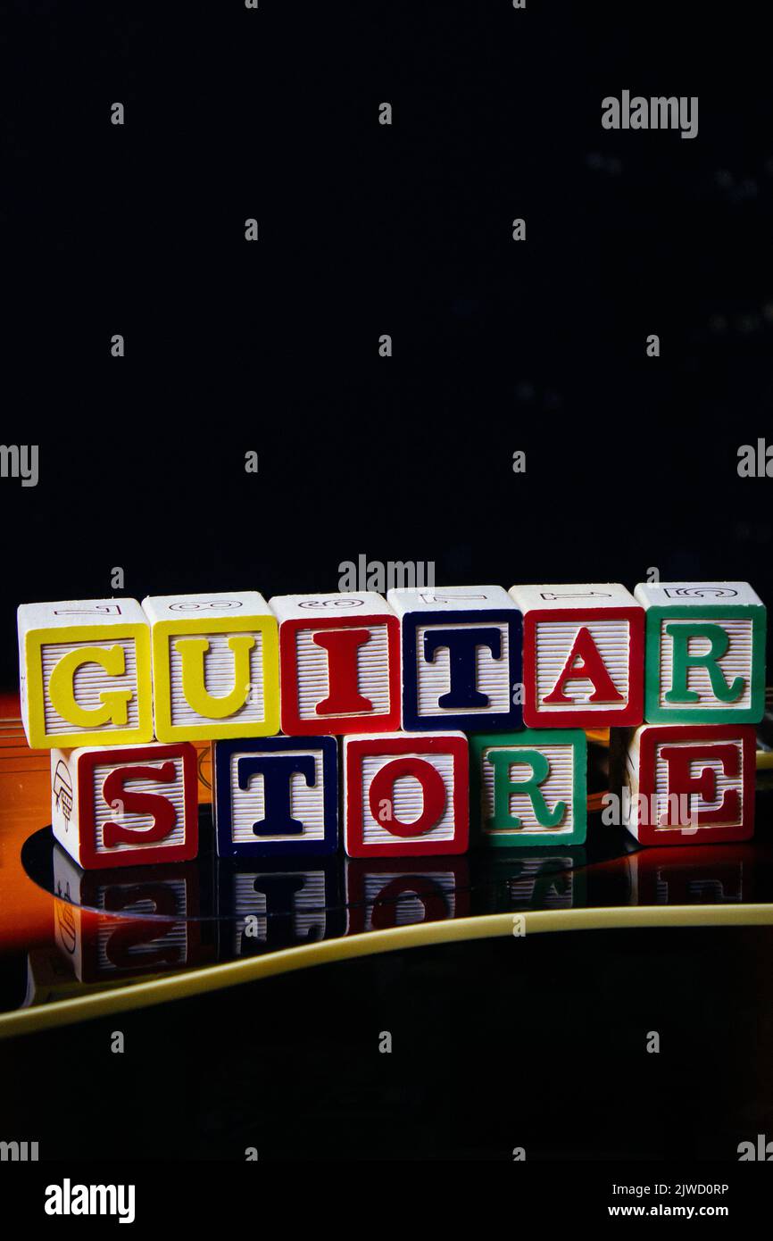 Word or phrase Guitar Store made with the letter cubes, standing on a ...