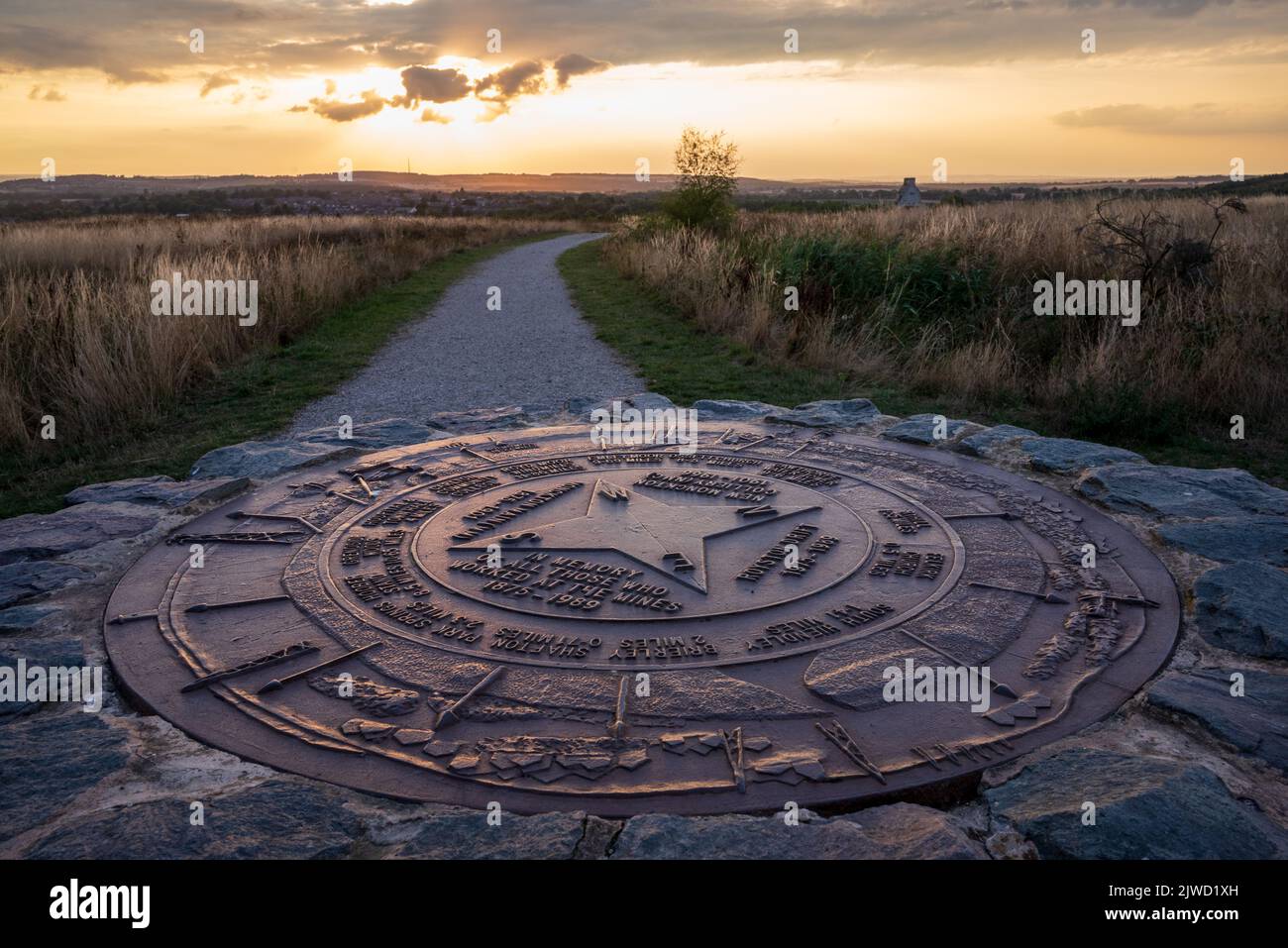 Brass plaque on circular stone plinth at the top of Rabbit Ings Country ...