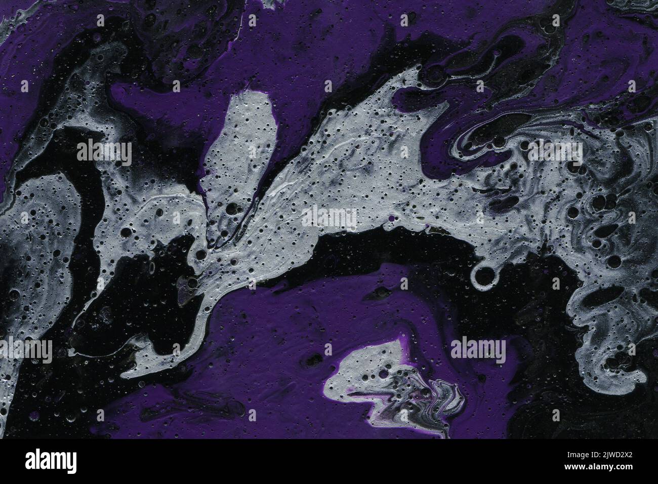 Acrylic texture made in fluid pour technique. Background in purple ...