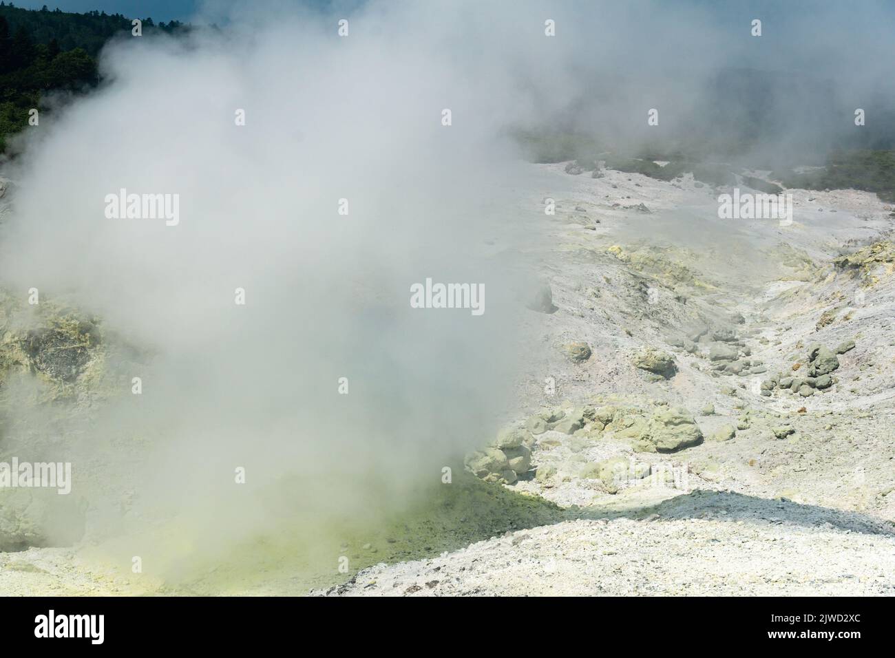 landscape of a fumarole field on the slope of a volcano is partially ...