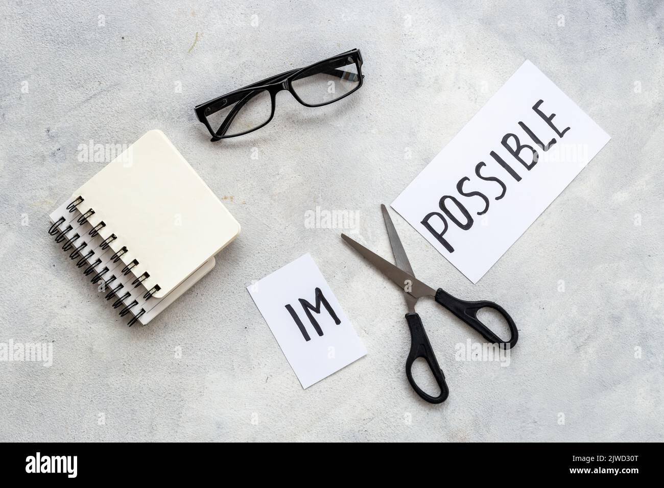 Change your life concept. Impossible cutting into Possible with ...