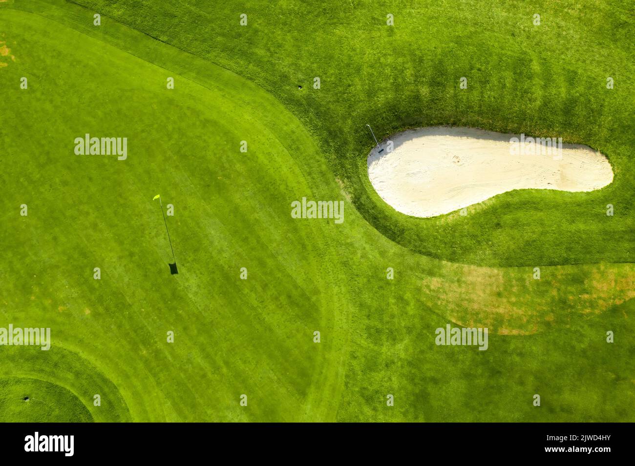 Aerial view of bunkers sand in golf court with putting green grass ...