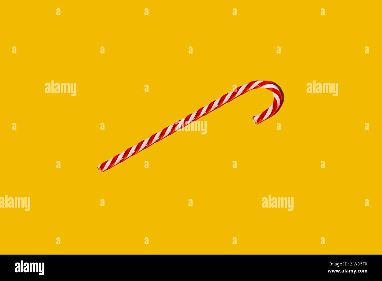 christmas symbol peppermint candy cane yellow Stock Photo - Alamy