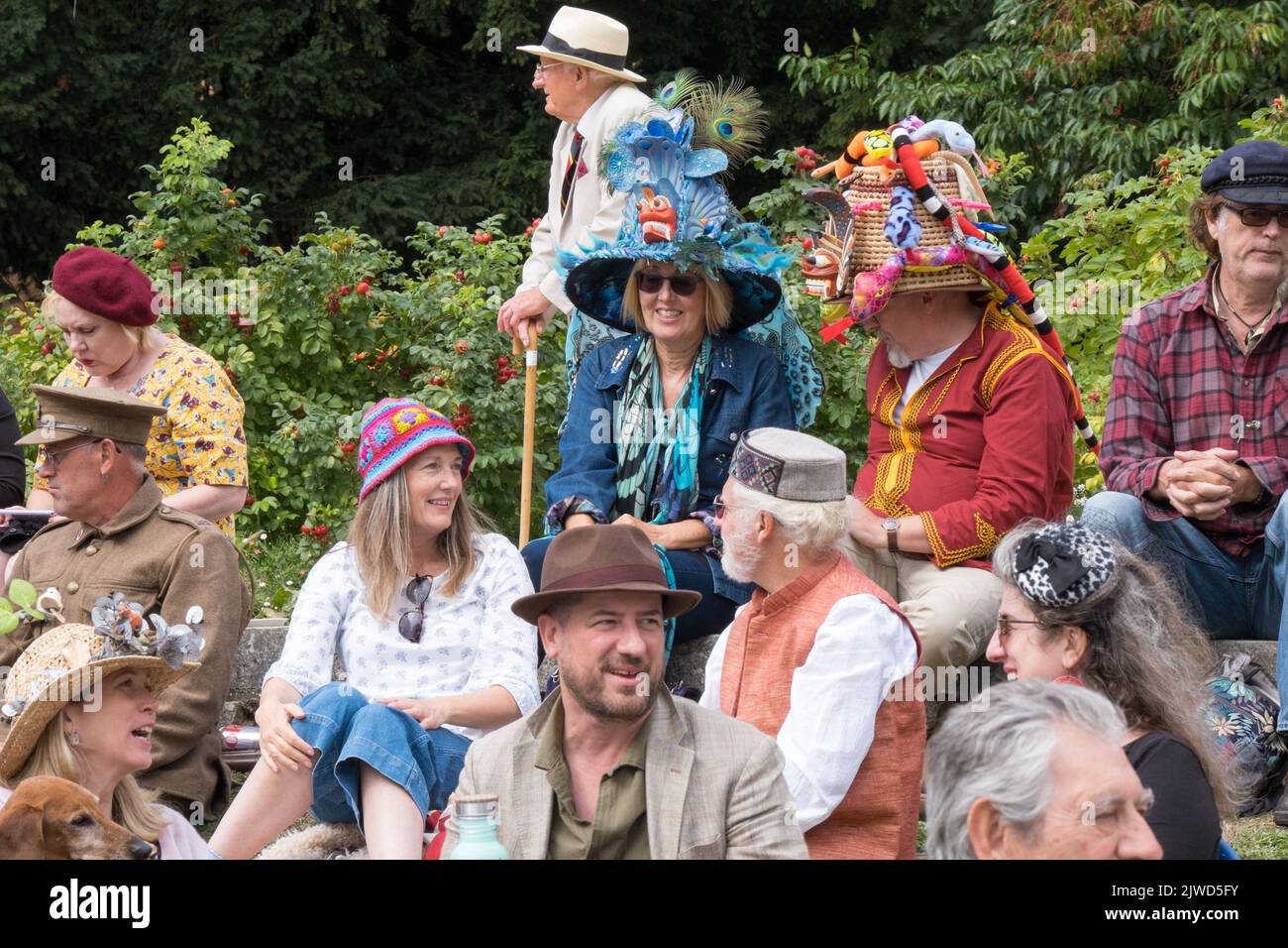 People enjoy dressing up at the Bridport Hat Festival Dorset 2022 Stock ...
