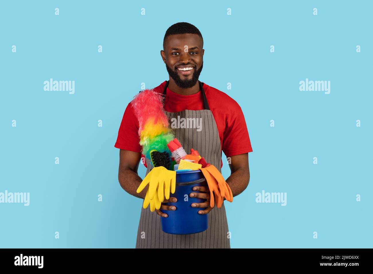 Spring Cleaning. Portrait Of Smiling Black Cleaner Guy Holding Basket ...