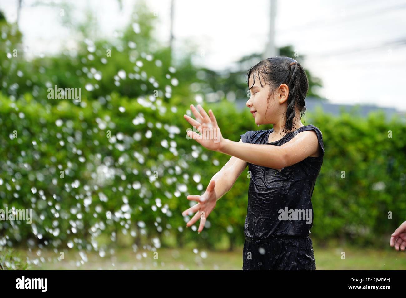 Group of kids playing on muck in the raining day Stock Photo - Alamy