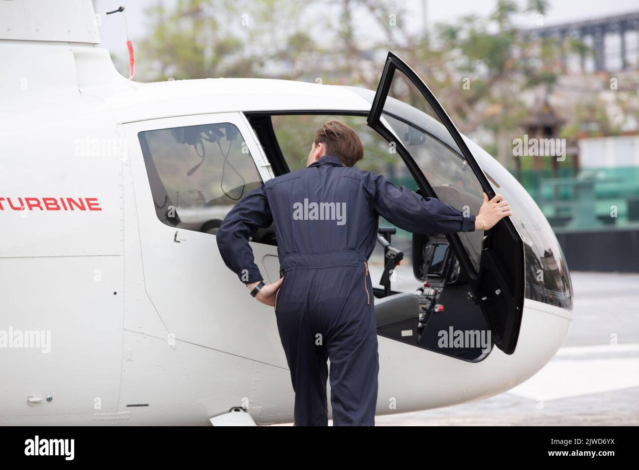 Mechanic in uniform are checking helicopter Stock Photo - Alamy