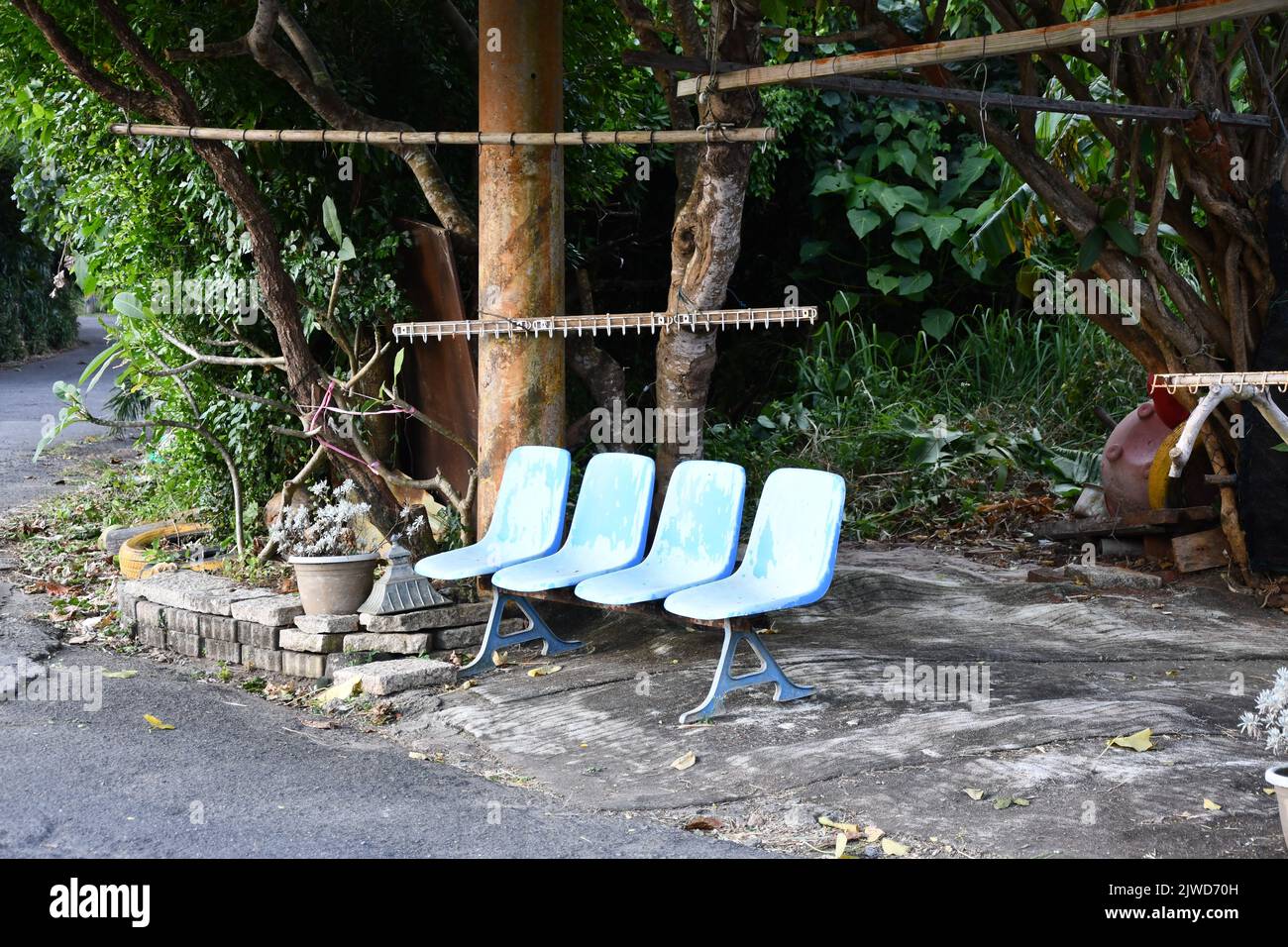 A blue bench made of single chairs near Cape Eluanbi, Taiwan Stock ...