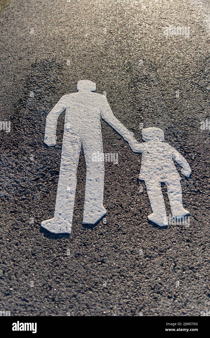 Asphalt road with white pedestrians sign painted on it, warning ...